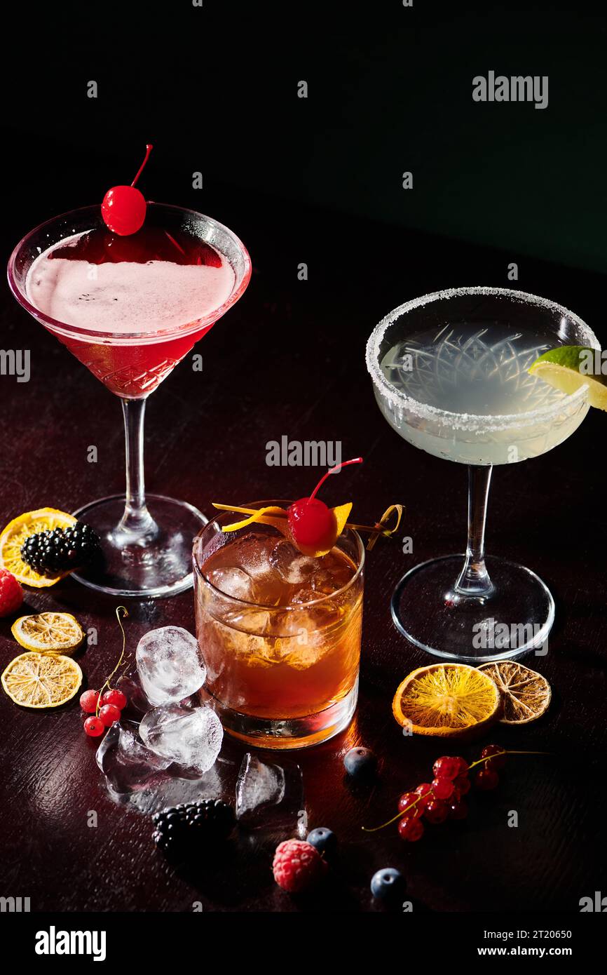 esthetic margarita, cosmopolitan and negroni with cocktail cherries and ...