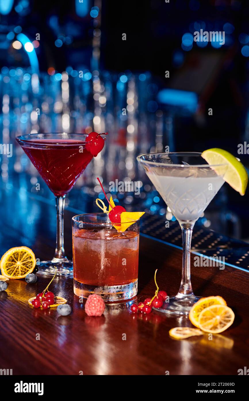 zesty sophisticated cocktails with garnishing on bar counter with fresh ...