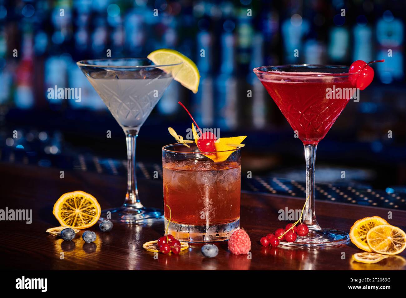 thirst quenching cocktails with fresh decorations on counter with bar ...