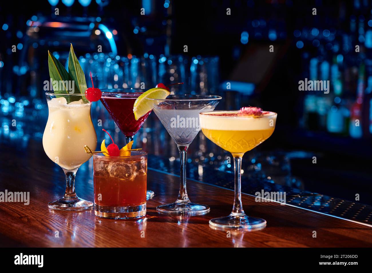 set of refreshing delicious cocktails with fresh garnishing on bar ...