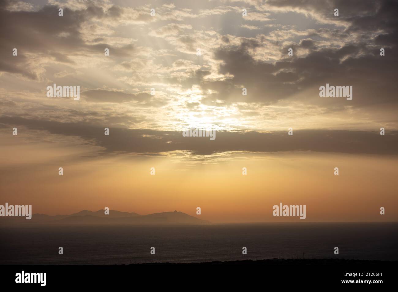 Sunset at cloudscape background. Sunbeam colors the sky, golden sun ...