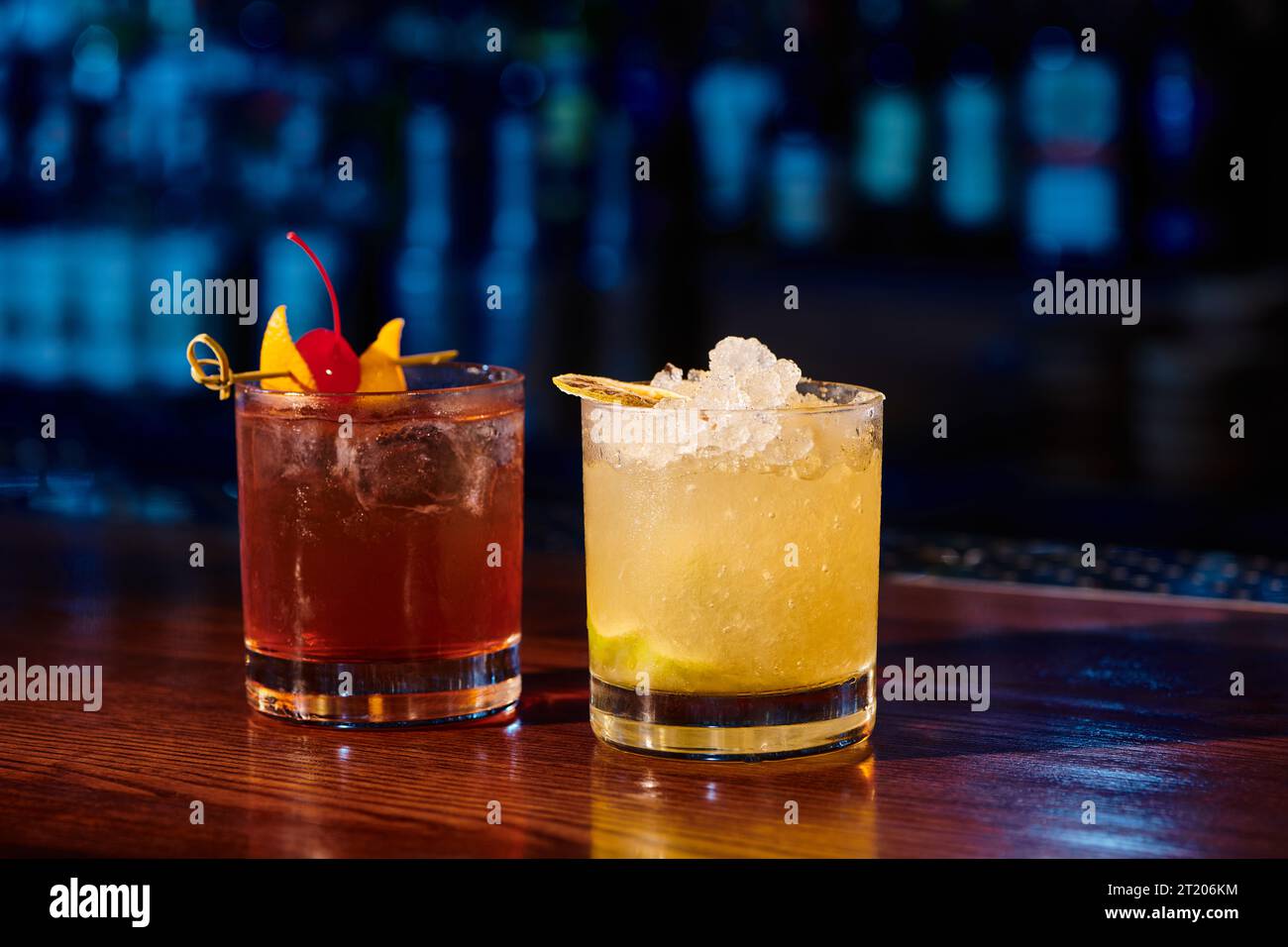 tropical negroni and caipirinha with ice and cherry decoration with bar ...