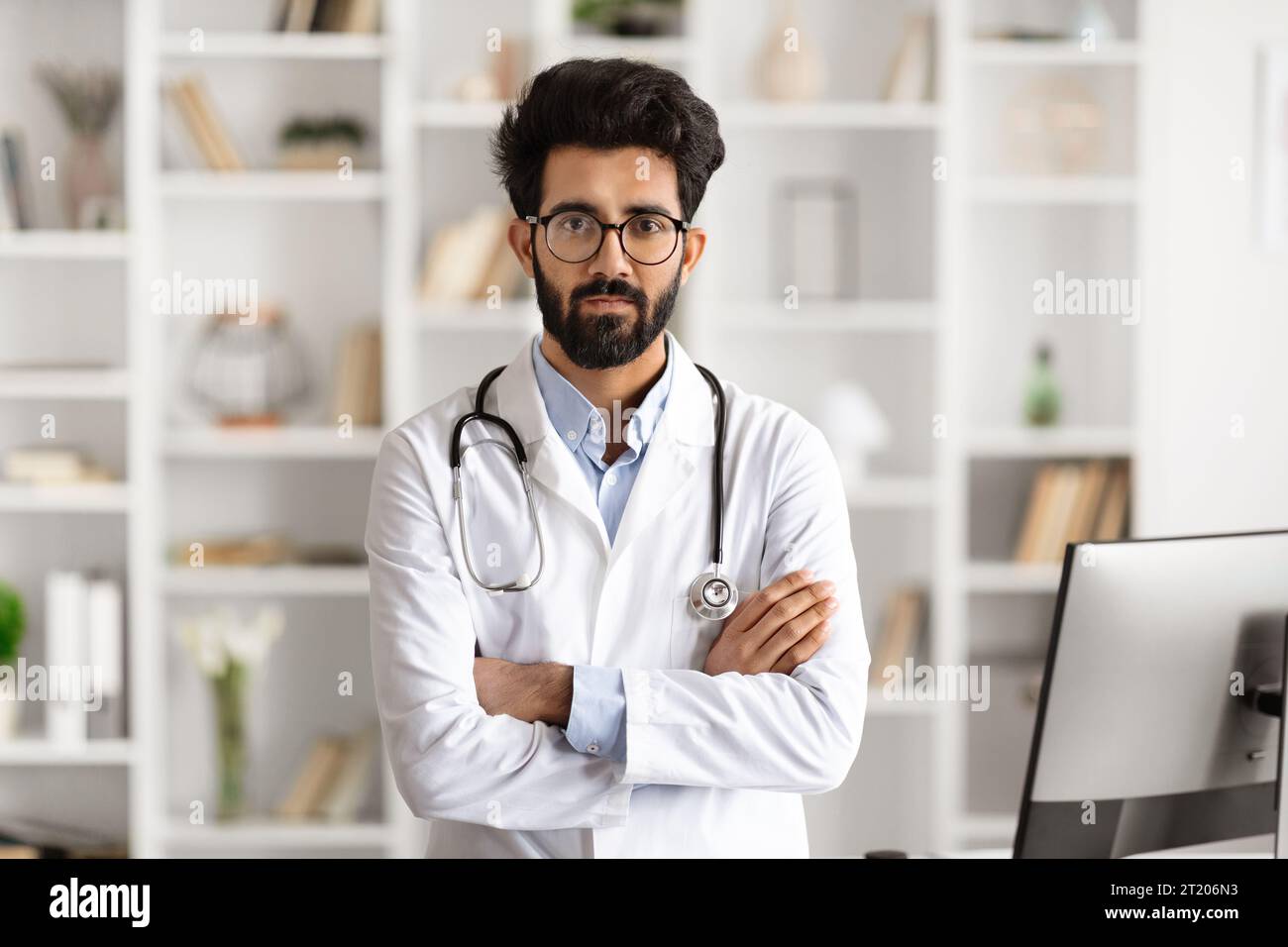 Professional Man in White Coat Near Clinic Desk Stock Photo - Alamy