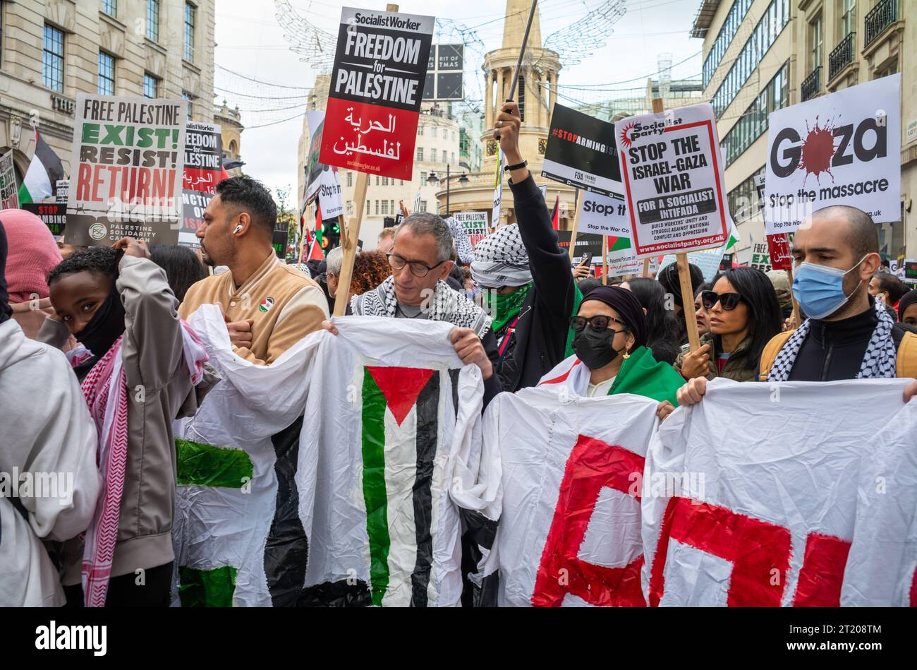 London, UK. 14 Oct 2023: Pro-Palestinian protesters with placards ...