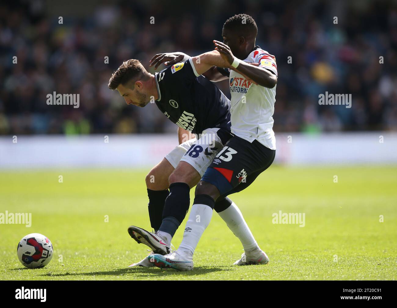 Ryan Leonard of Millwall battles Marvelous Nakamba of Luton Town ...