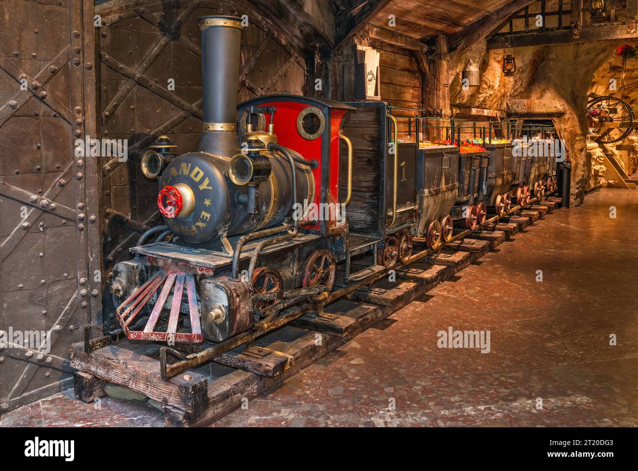Miniature steam engine locomotive, mine carts filled up with candies at ...