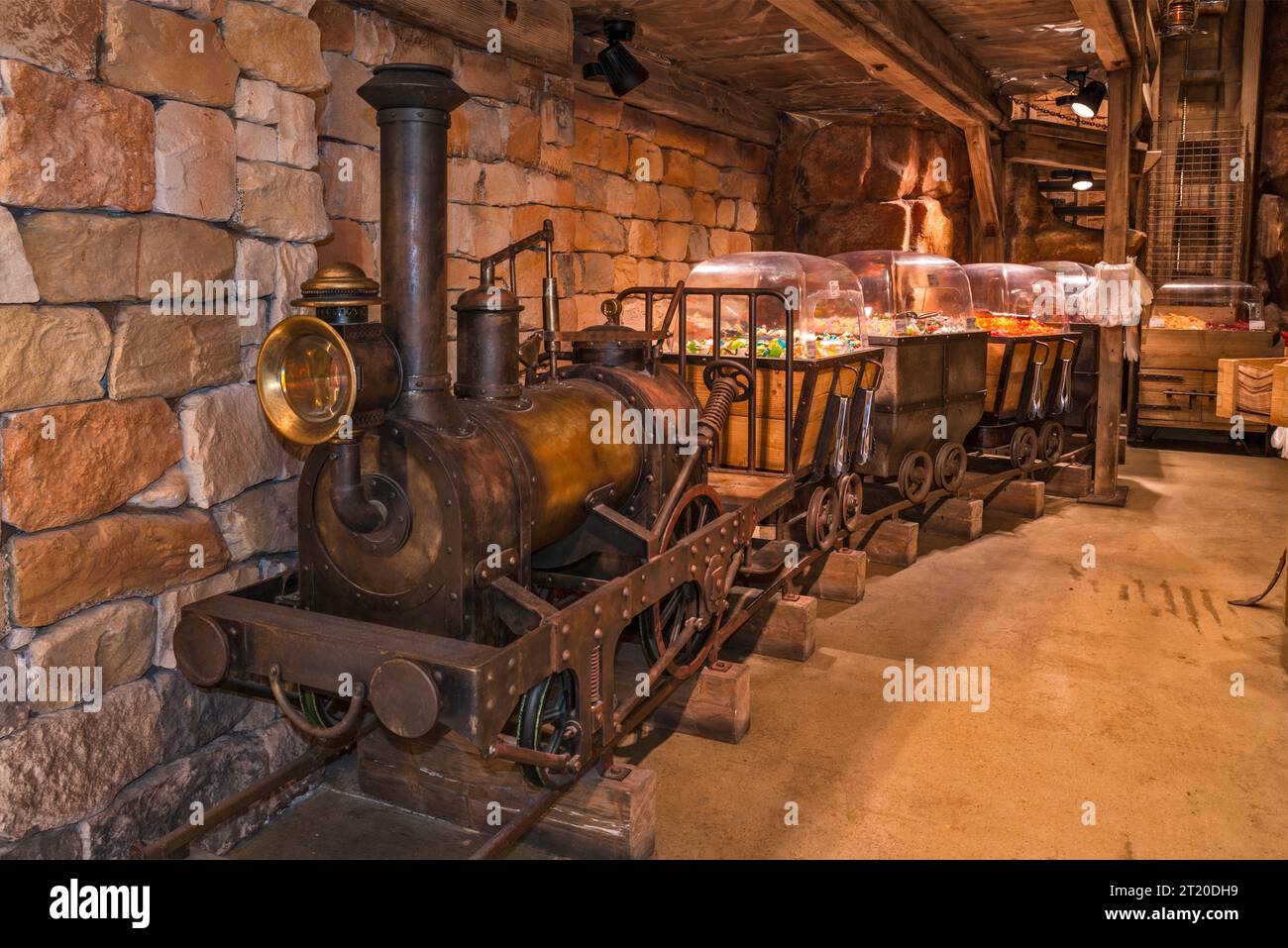 Miniature steam engine locomotive, mine carts filled up with candies at ...