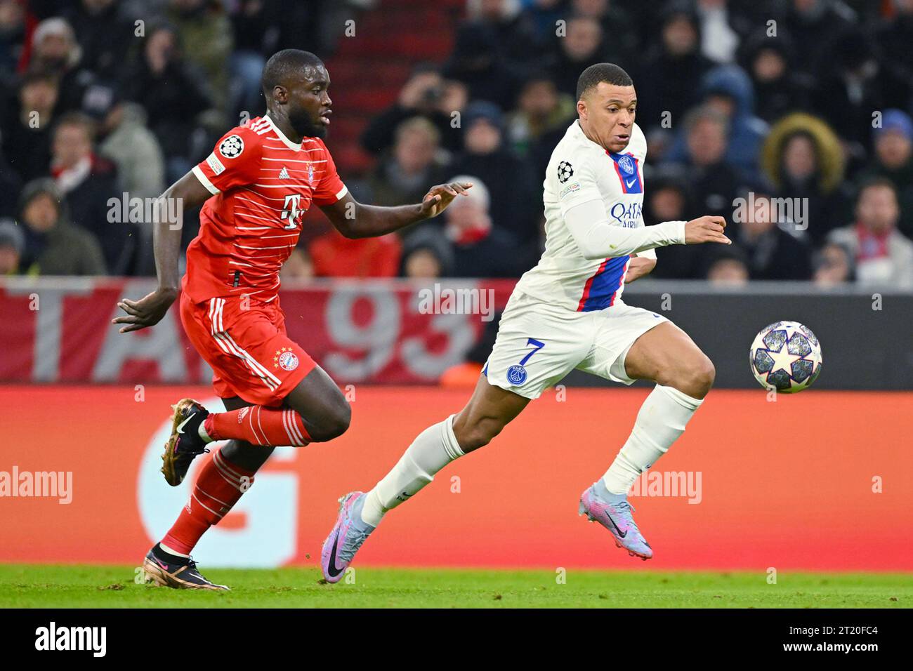 Kylian Mbappe of Paris Saint-Germain and Dayot Upamecano of FC Bayern ...