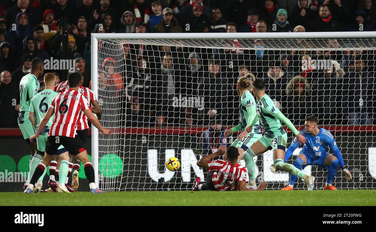 GOAL 1-0, Ethan Pinnock of Brentford scores a goal deflected in by Tim Ream of Fulham for a own ...