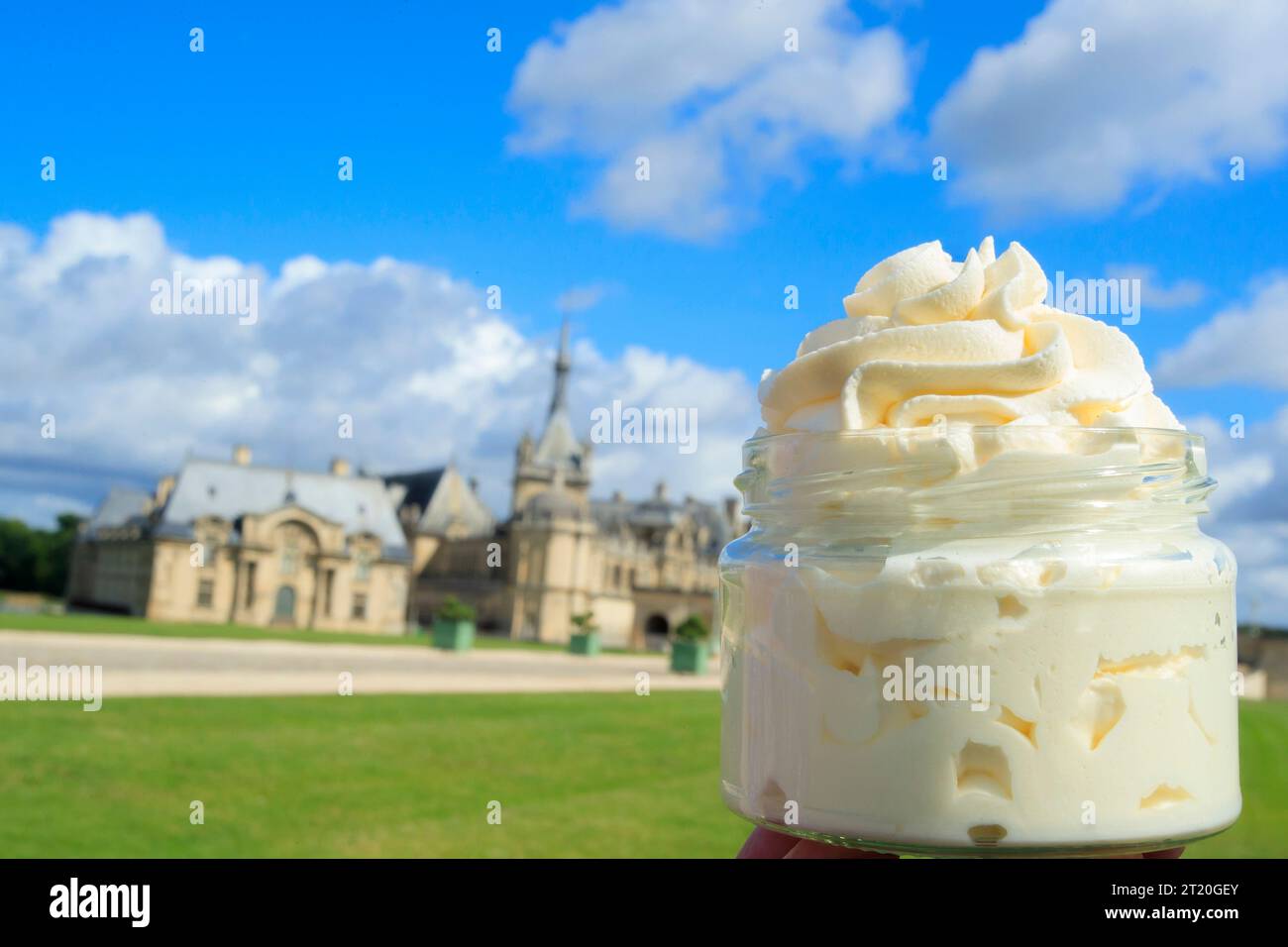 Pot of Chantilly cream, whipped cream, in front of the Chateau de ...