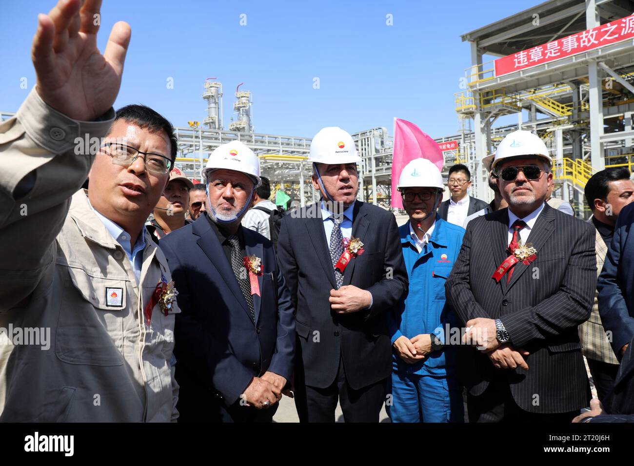 Baghdad, Iraq. 29th Sep, 2023. A Chinese employee introduces the ...