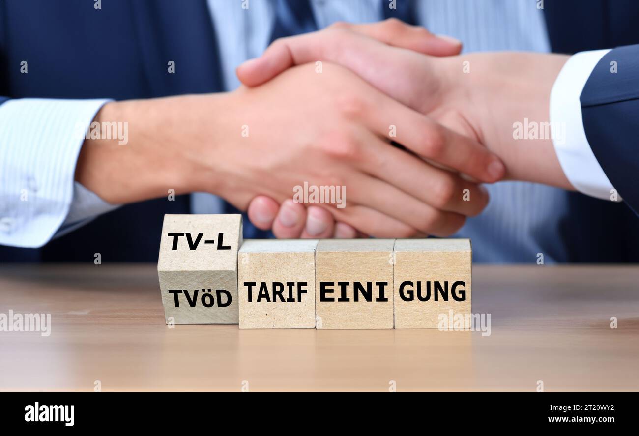 Cubes form the German expression 'TV-L Tarifeinigung' (tariff agreement ...