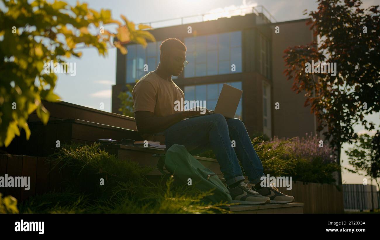 African american man laptop outdoors hi-res stock photography and ...