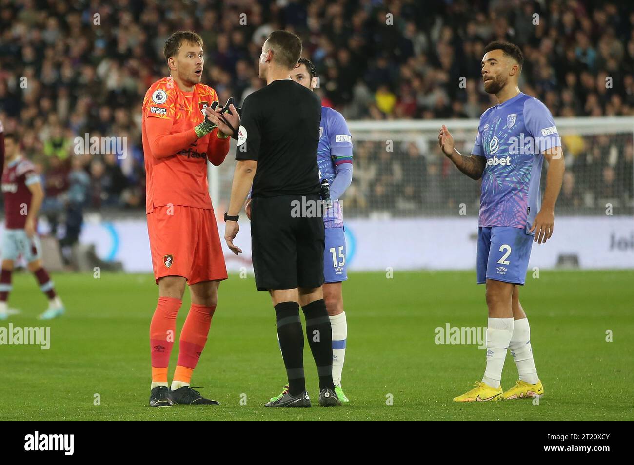 Neto of Bournemouth & Adam Smith of Bournemouth look frustrated with Referee, David Coote after ...