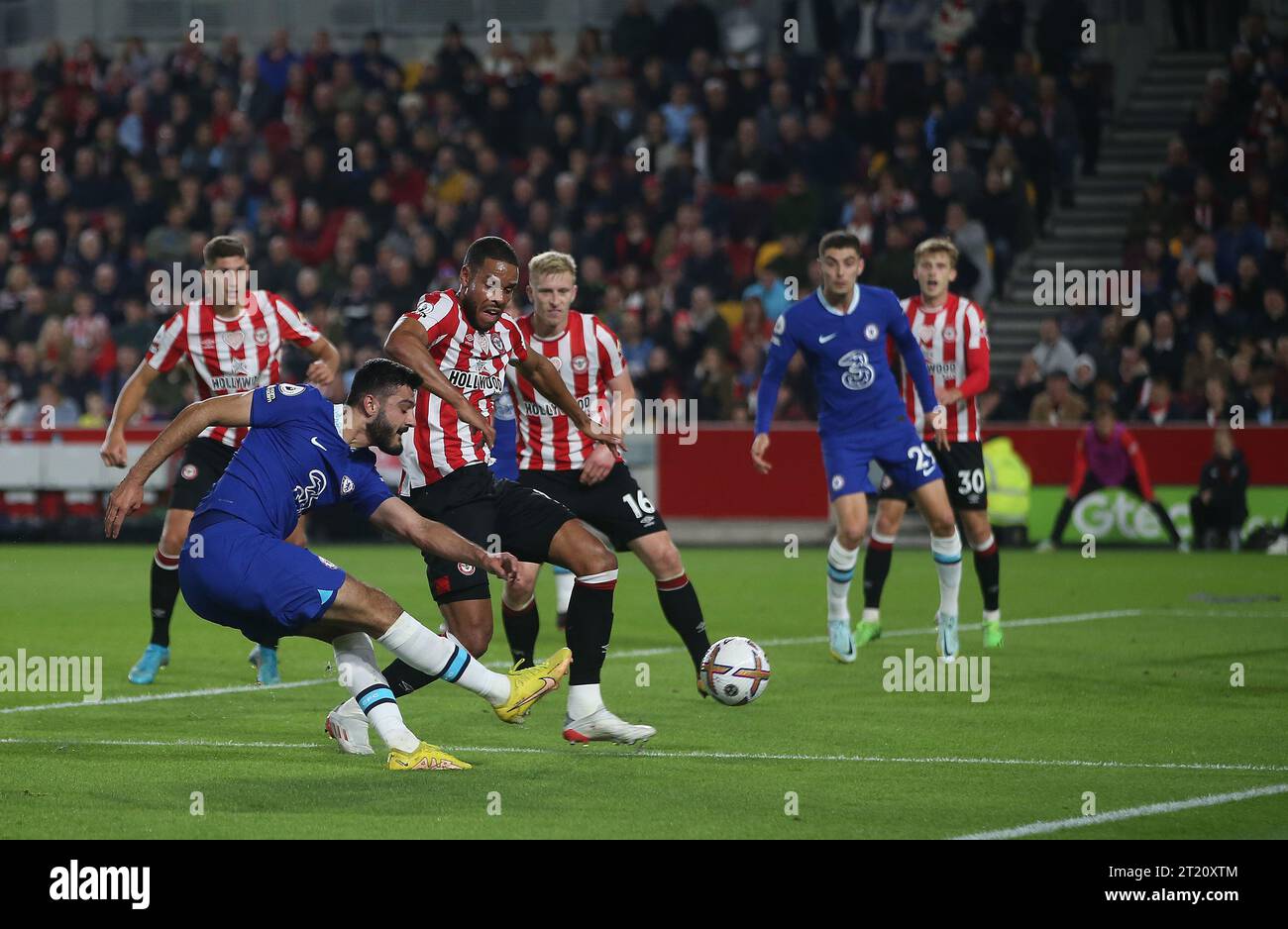 Pontus Jansson of Brentford has a cross shot go straight across the goal mouth six yard area ...