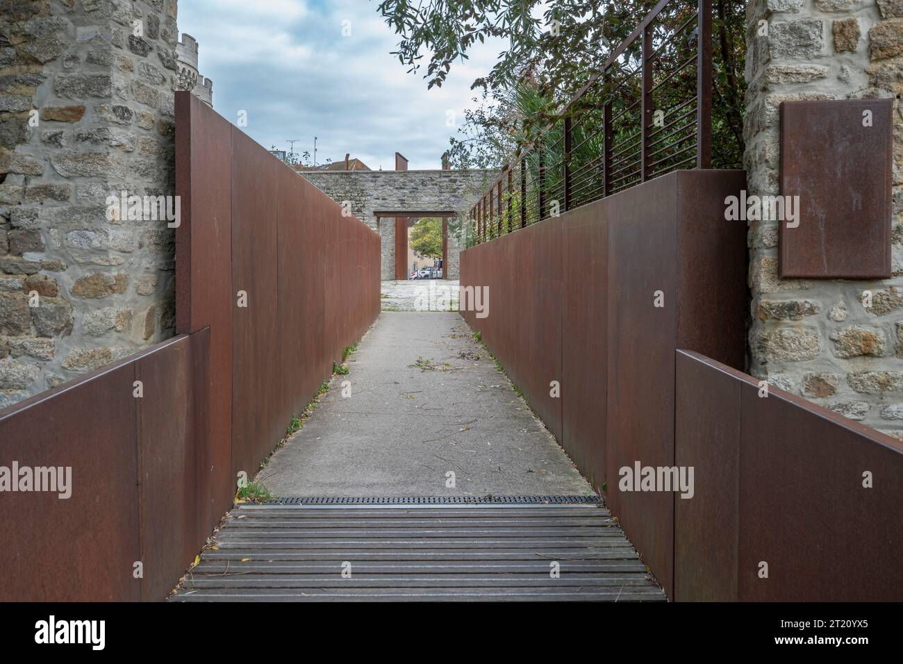 View of a passageway between the park and the Castle of the Dukes of ...