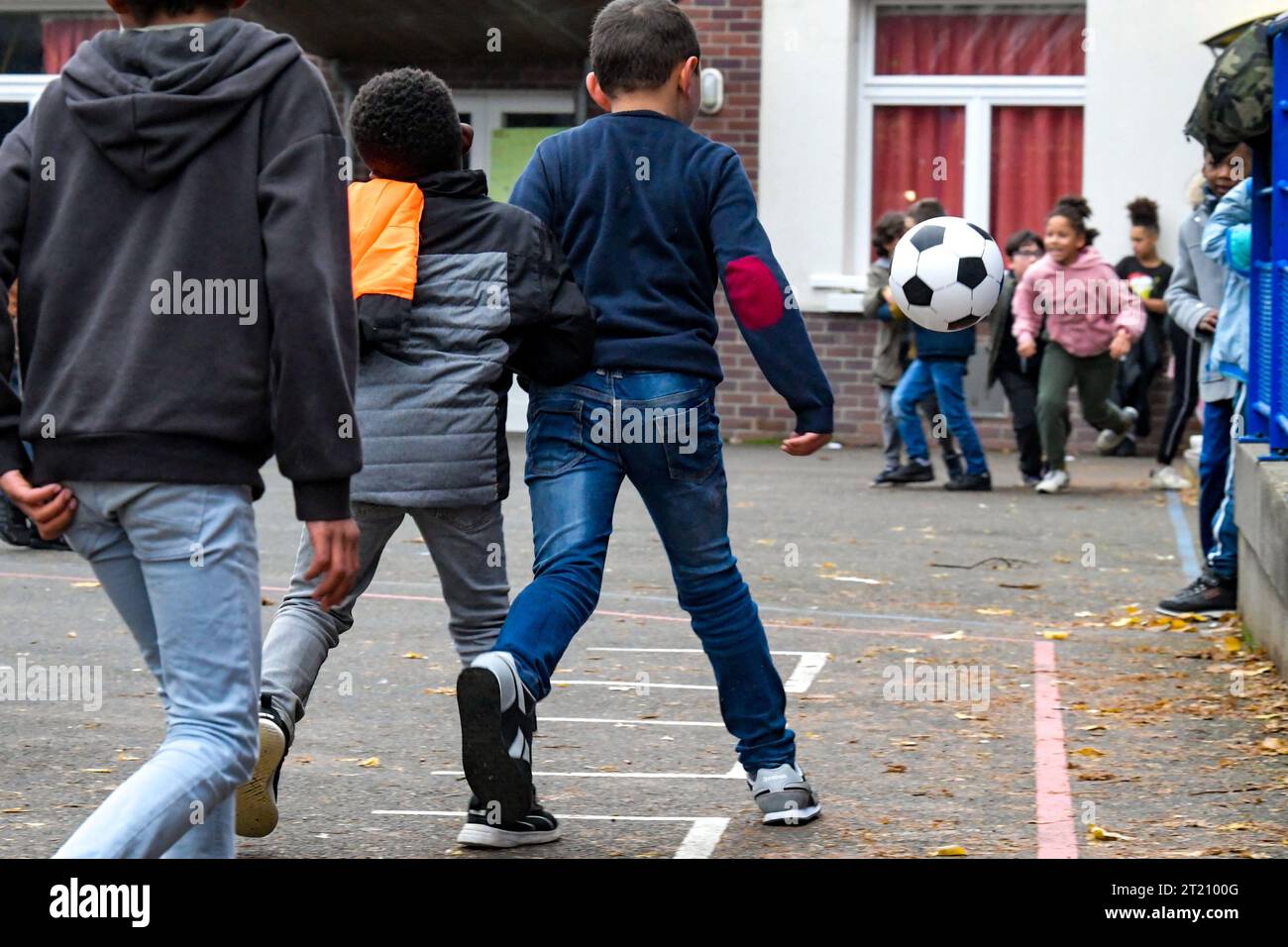 Children playing in an elementary school playground Stock Photo - Alamy