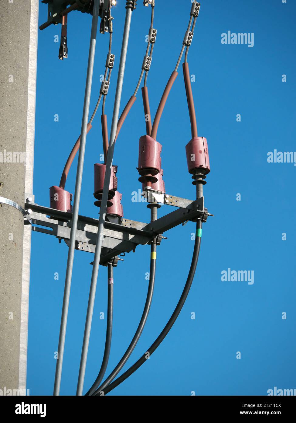 Insulators on power lines on a pole of an overhead power line Stock ...