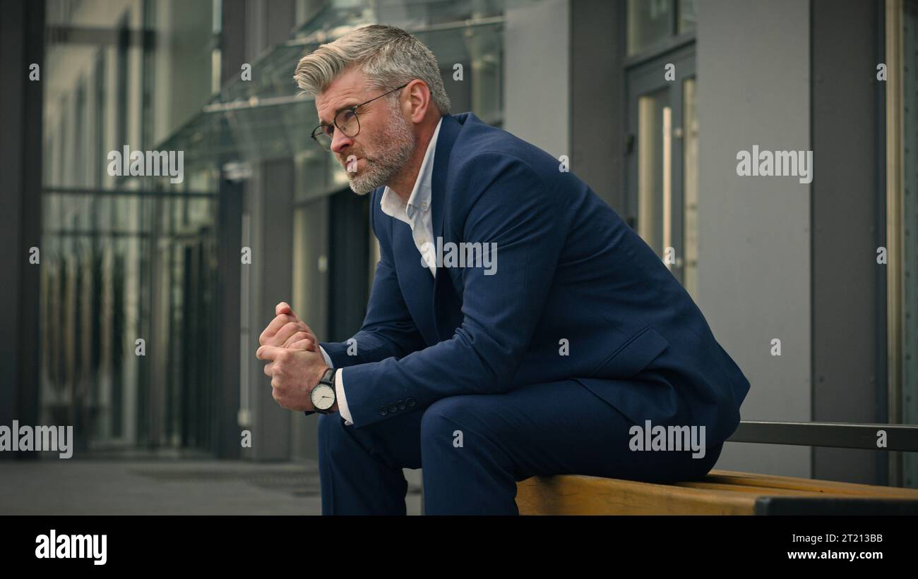 Stressed middle aged senior adult Caucasian business man suffering ...