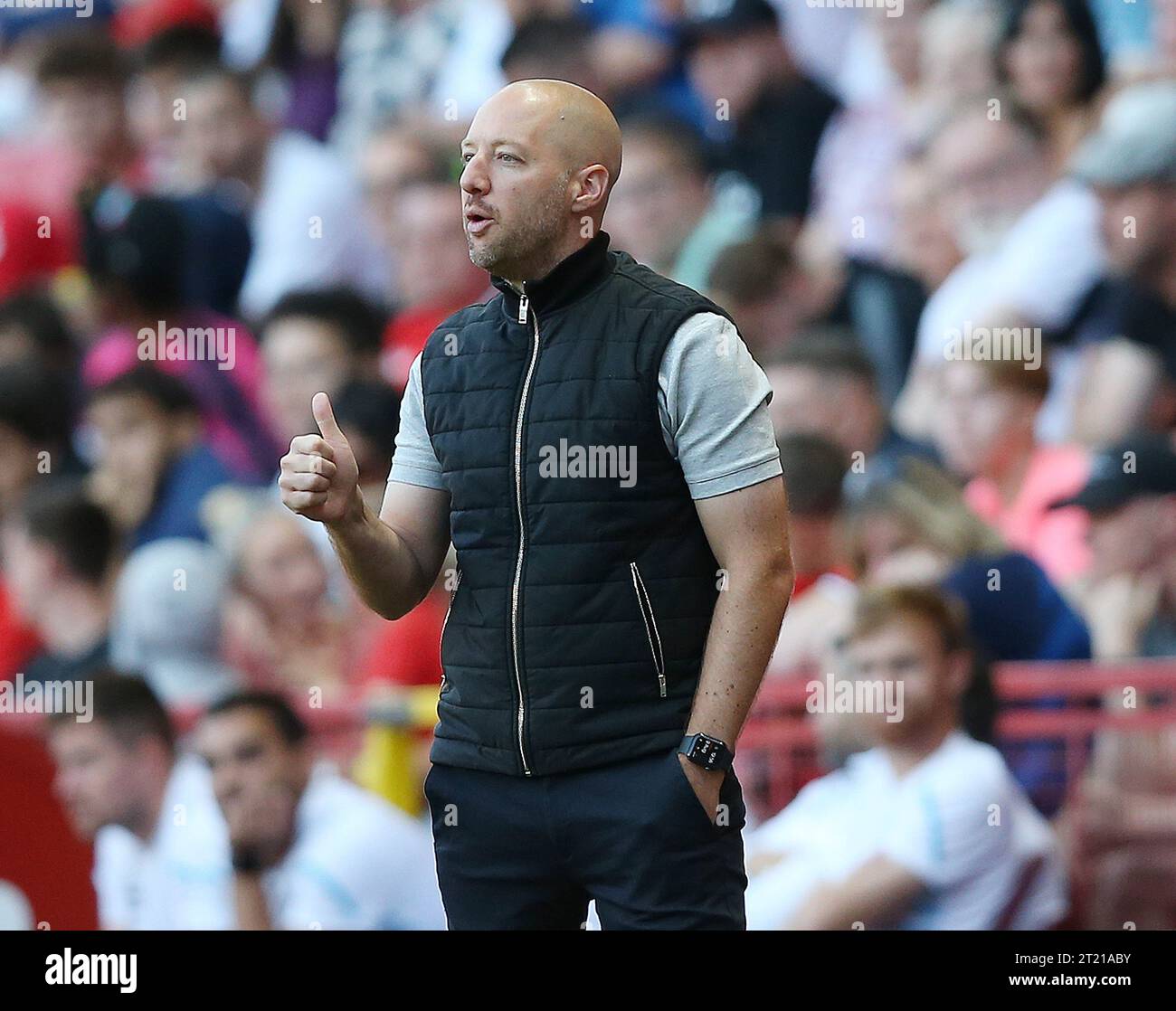 Ben Garner Manager of Charlton Athletic gives his players the thumbs up ...