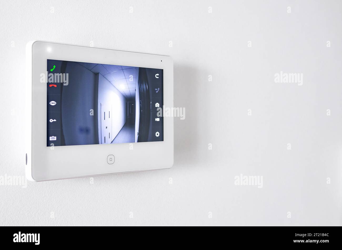 A white video intercom screen on a white apartment wall Stock Photo - Alamy