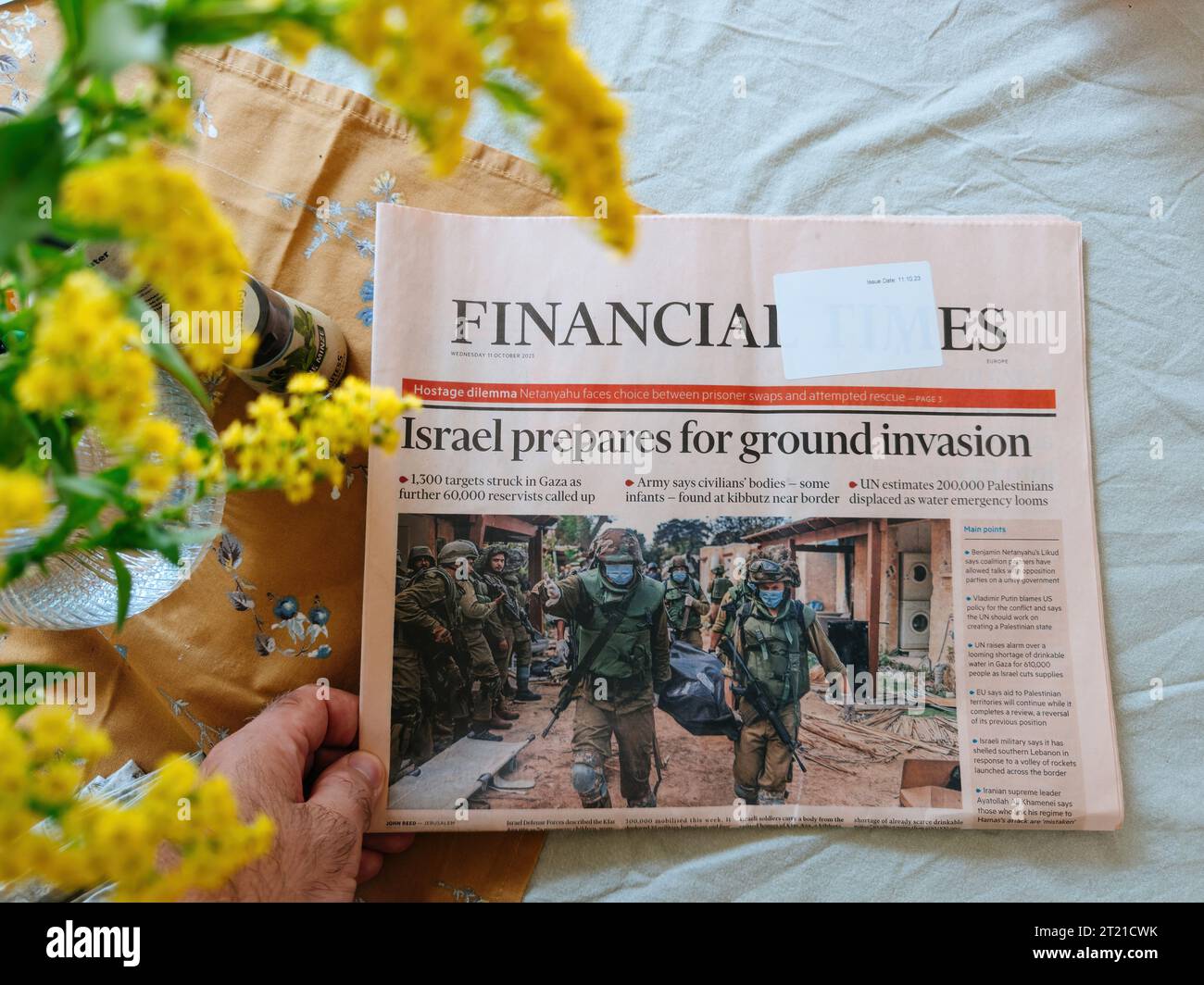Paris, France - Oct 11, 2023: Man reading latest Financial Times ...