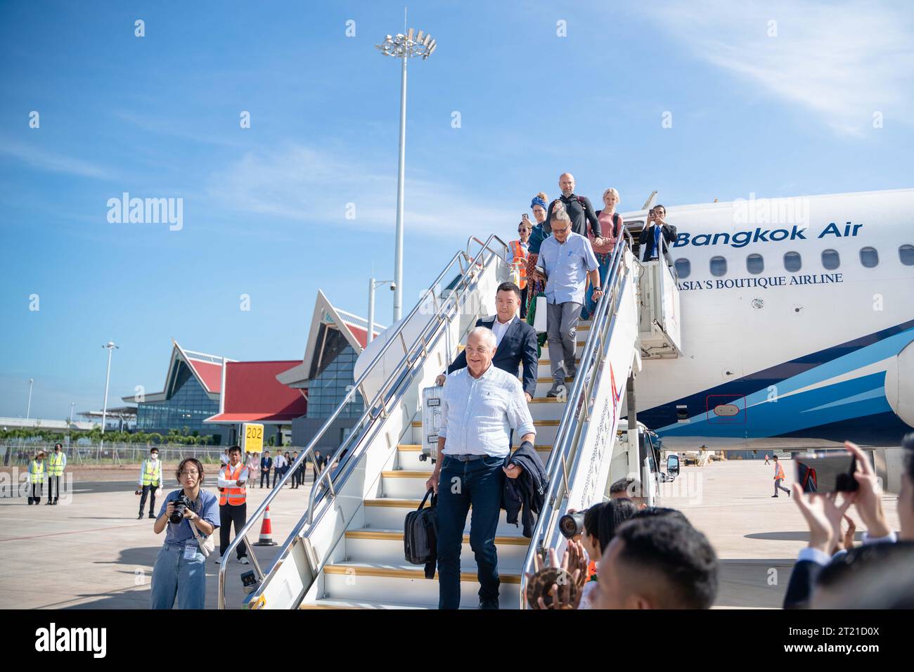 Siem Reap. 16th Oct, 2023. Passengers disembark from a plane at the Chinese-invested Siem Reap ...