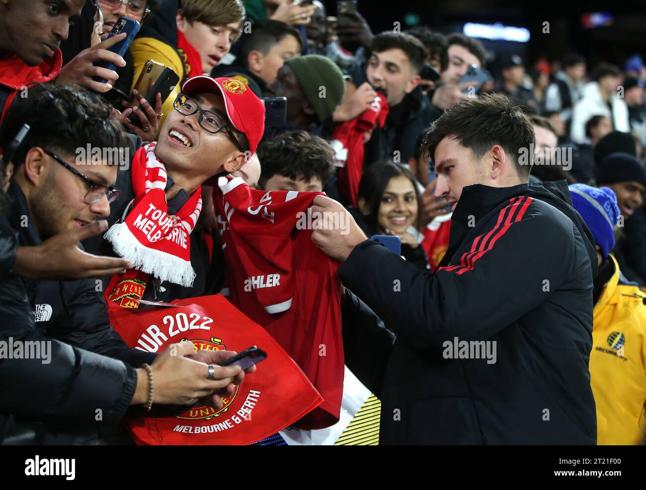 Harry Maguire of Manchester United signs autographs for the Australian ...