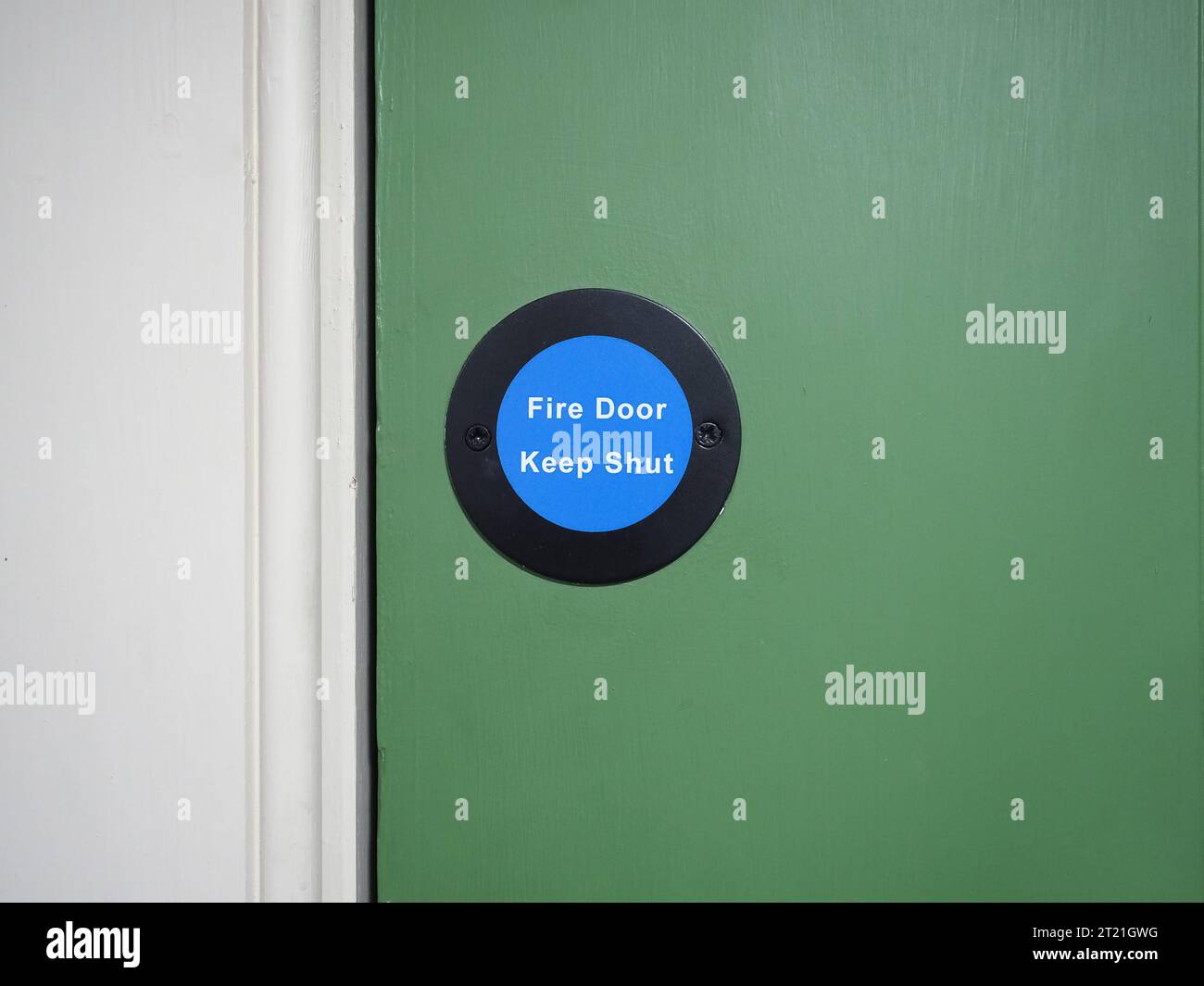 fire door keep shut sign on a hotel room door Stock Photo - Alamy