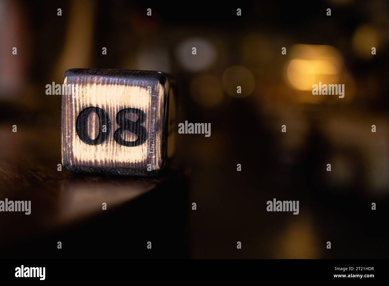 The number 08 on the wooden cube is burned with large symbols Stock ...