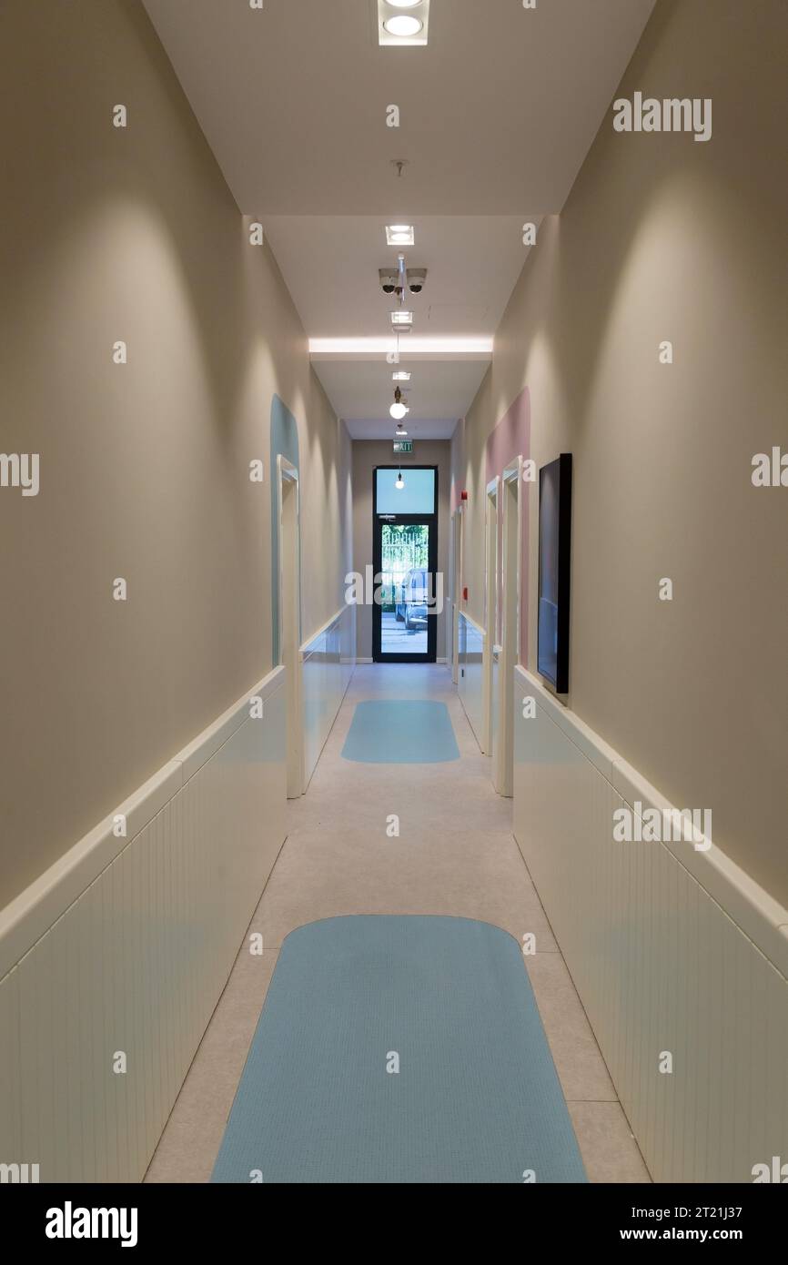 Long narrow corridor with access street at the end Stock Photo - Alamy