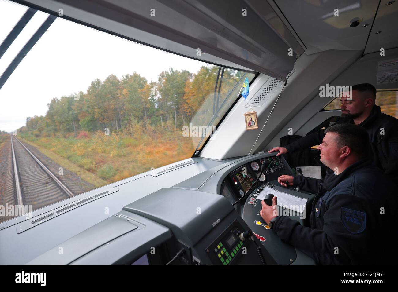 LVIV REGION, UKRAINE - OCTOBER 15, 2023 - Drivers are seen in the cabin ...