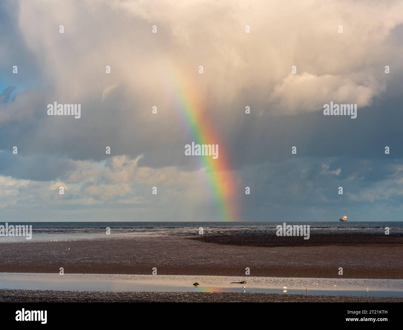 Rainbow and shower cloud clearing Poolbeg Beach and Sandymount Strand ...