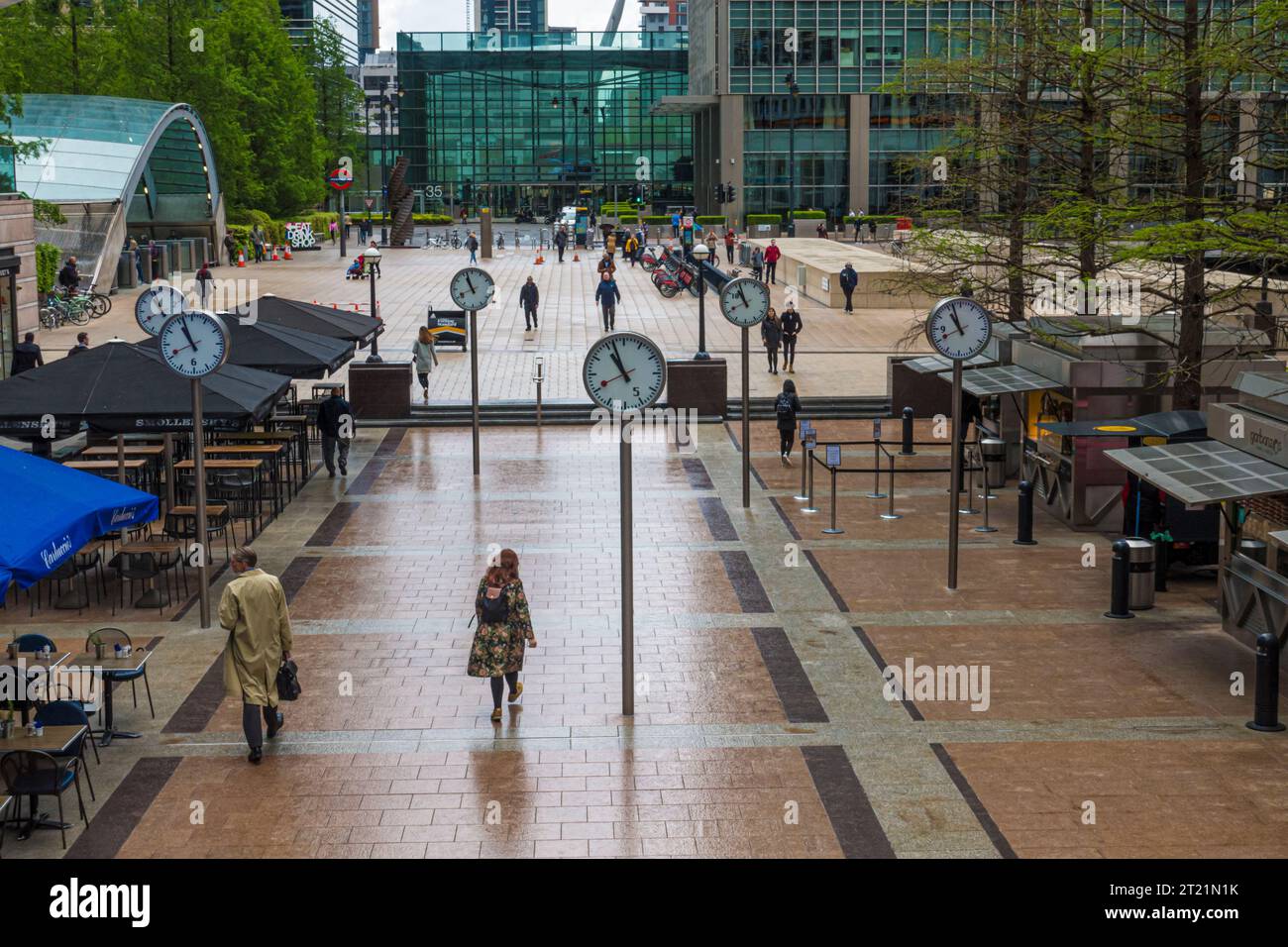 Commuters walking through Reuters Plaza, Canary Wharf, London. Six ...