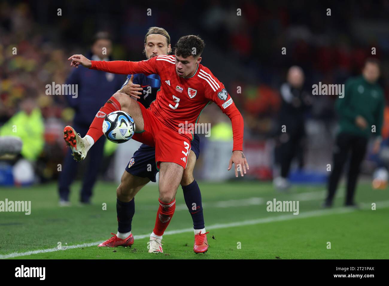 Cardiff, UK. 15th Oct, 2023. Neco Williams of Wales holds off Lovro ...