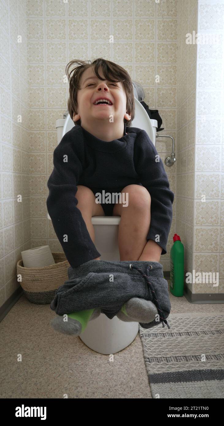 One Small Boy Sitting on Toilet in Bathroom, Childhood Potty Training ...