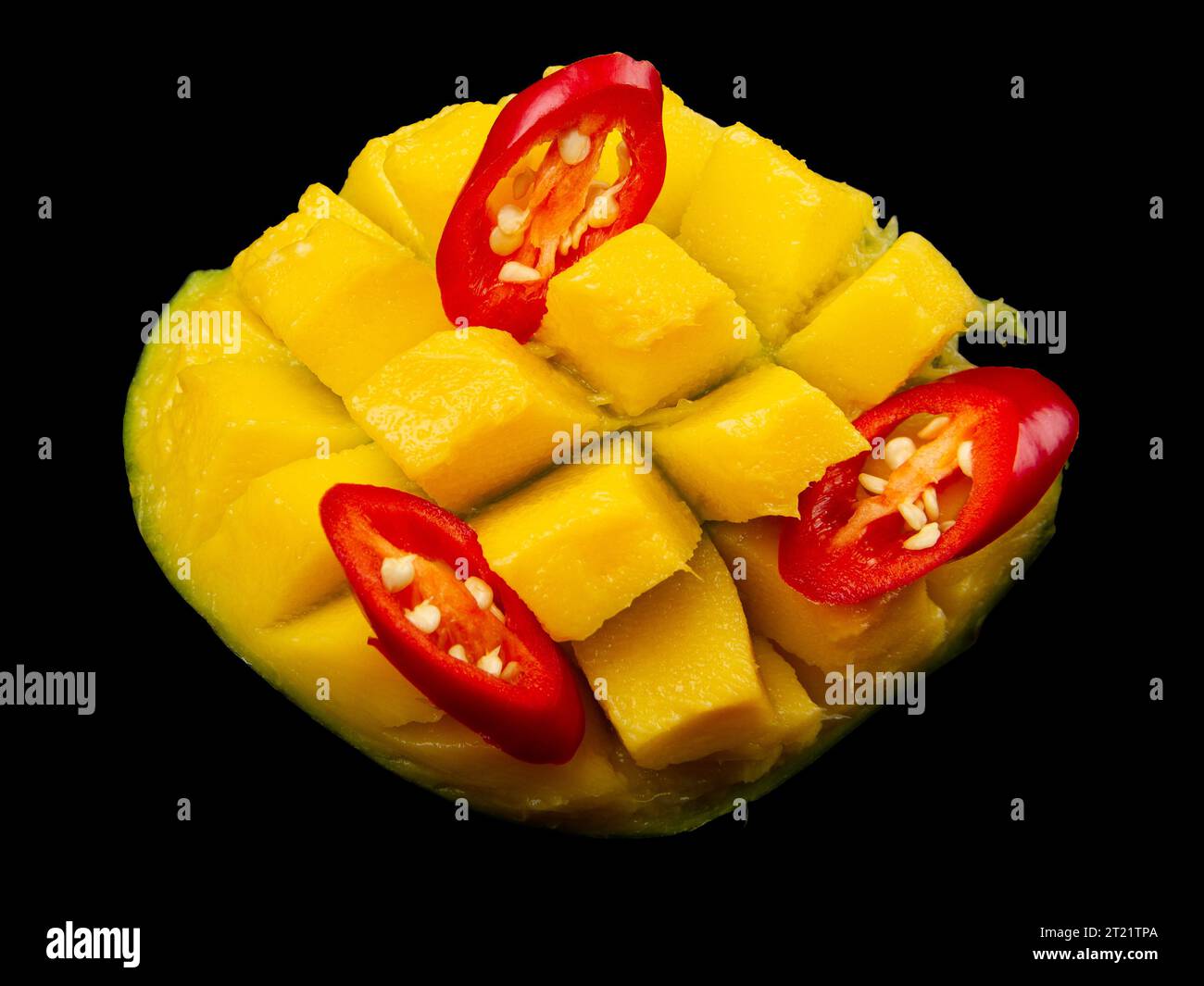 Closeup of red chili pepper rings and cutted half of mango isolated on ...