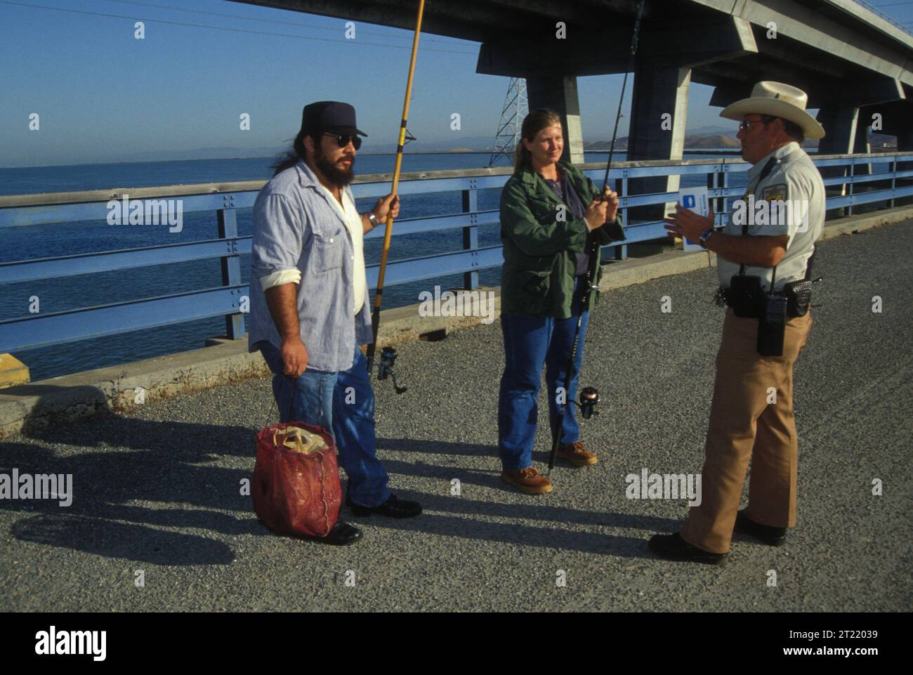 A U.S. Fish and Wildlife Service law enforcement officer speaks with ...