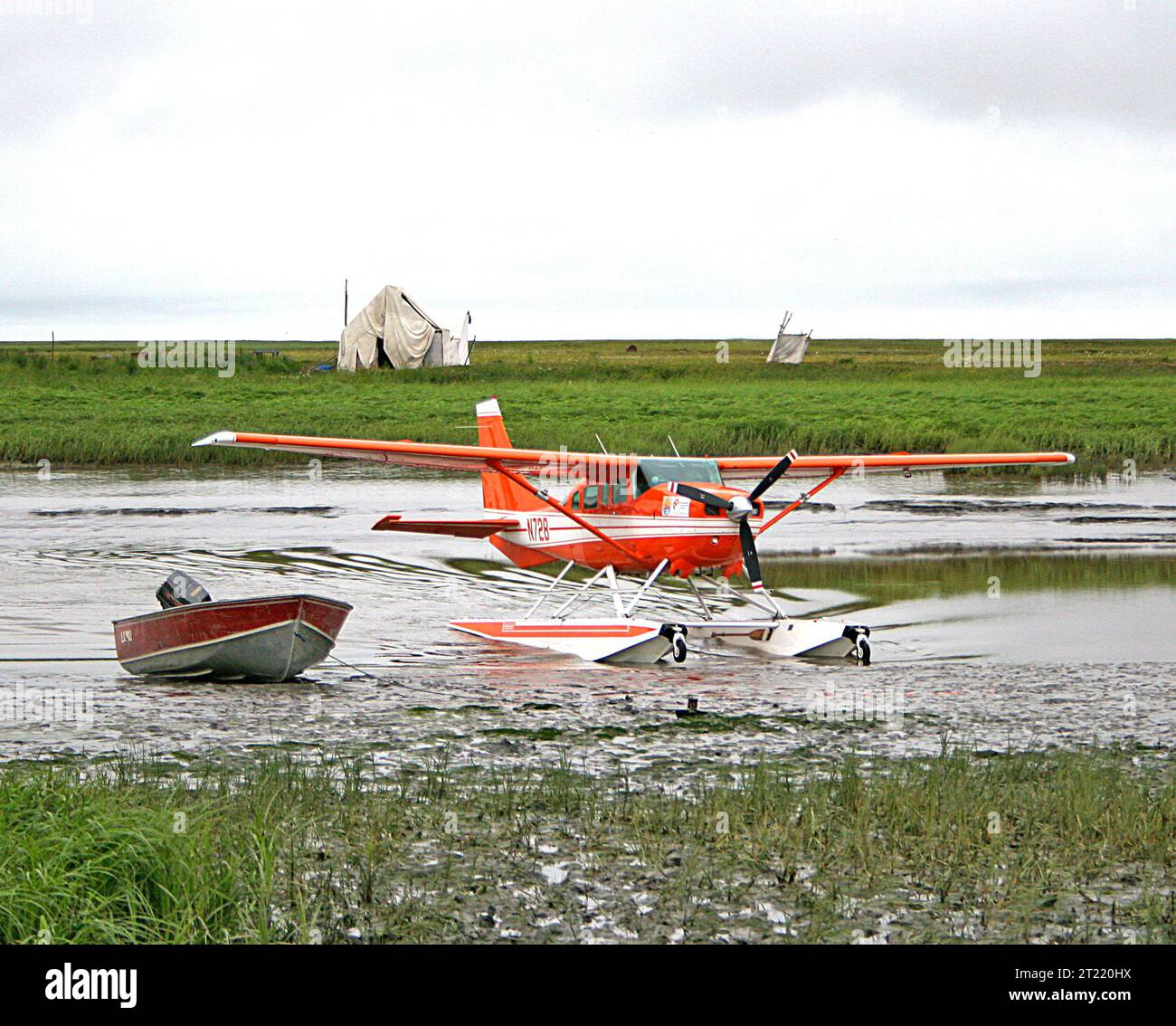 Cessna floatplane (amphibs) parked at the Old Chevak field site on the ...