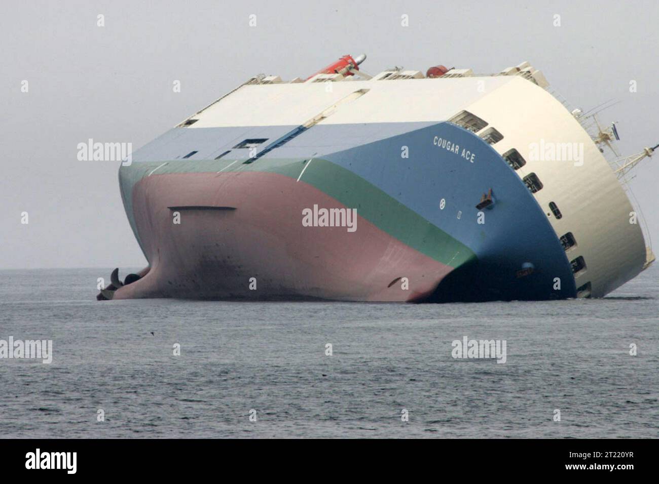 The Cougar Ace, a 654-foot car carrier, listed heavily after ballast ...