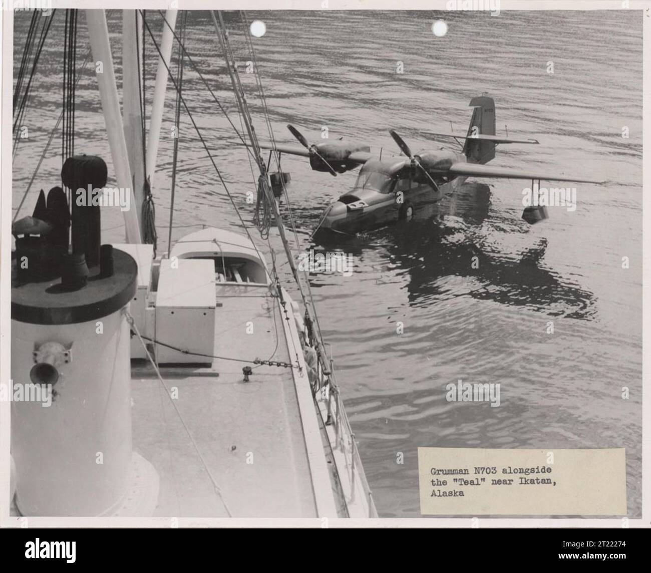 The Grumman N703 amphibious aircraft is seen beside the vessel Teal ...