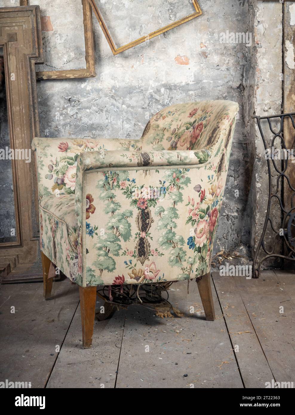 Vintage style . Defective old broken chair in an old dirty room with ...
