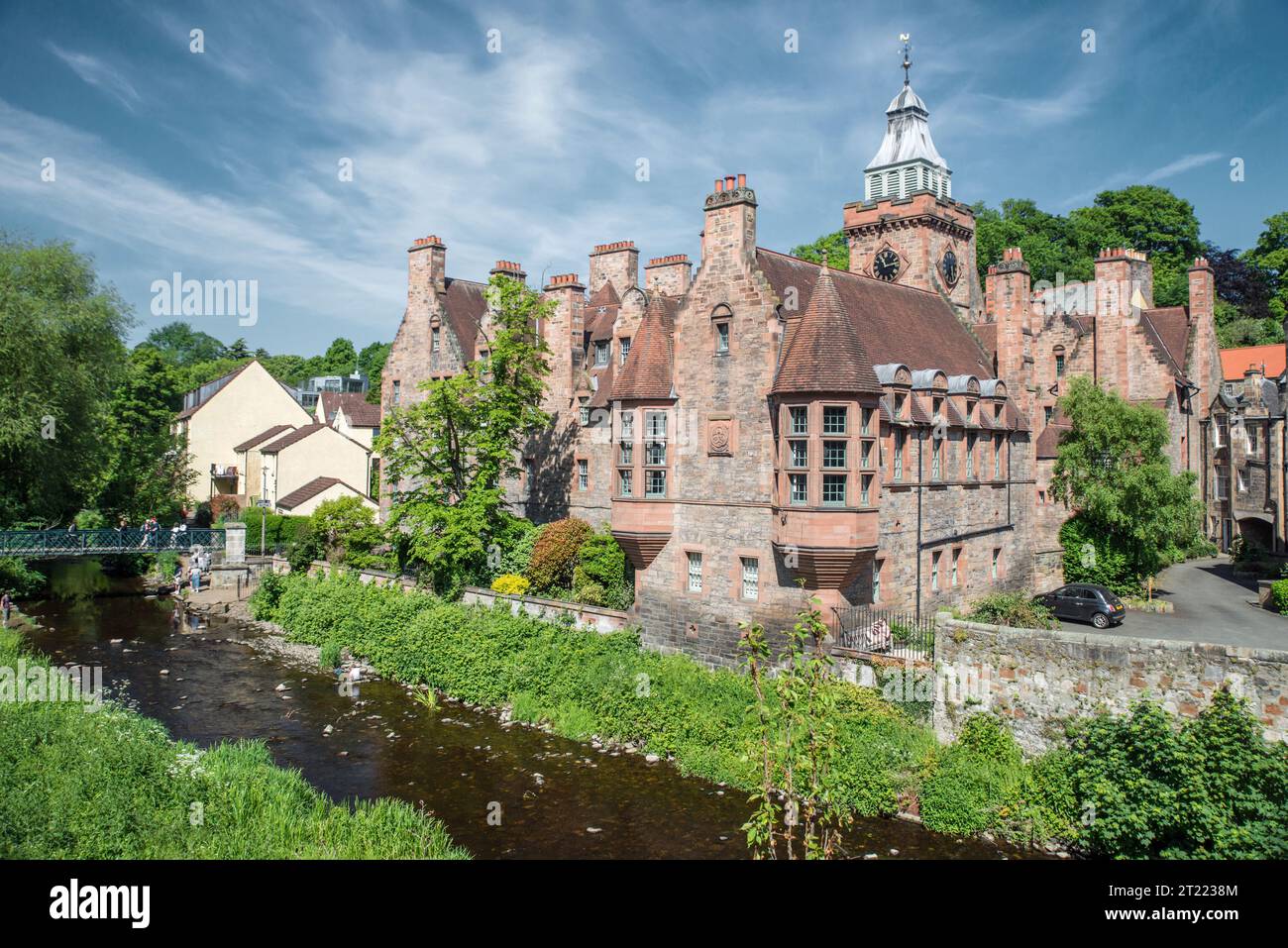 The red sandstone Gothic Parish Church on the bank of the Water of ...
