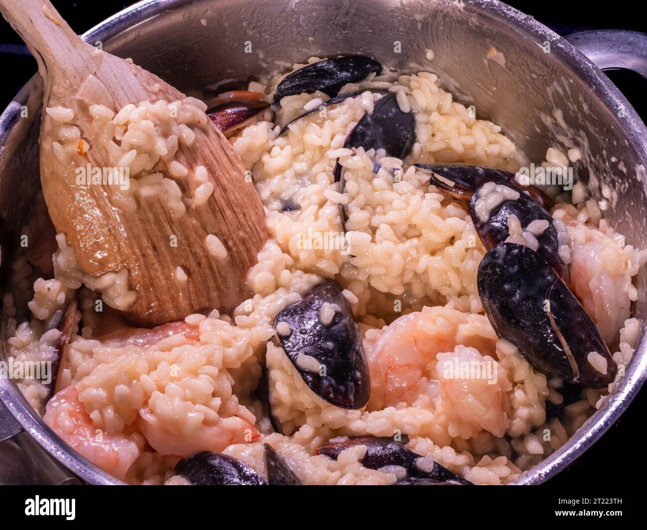 Creating a delectable Italian seafood risotto with saffron-infused rice ...