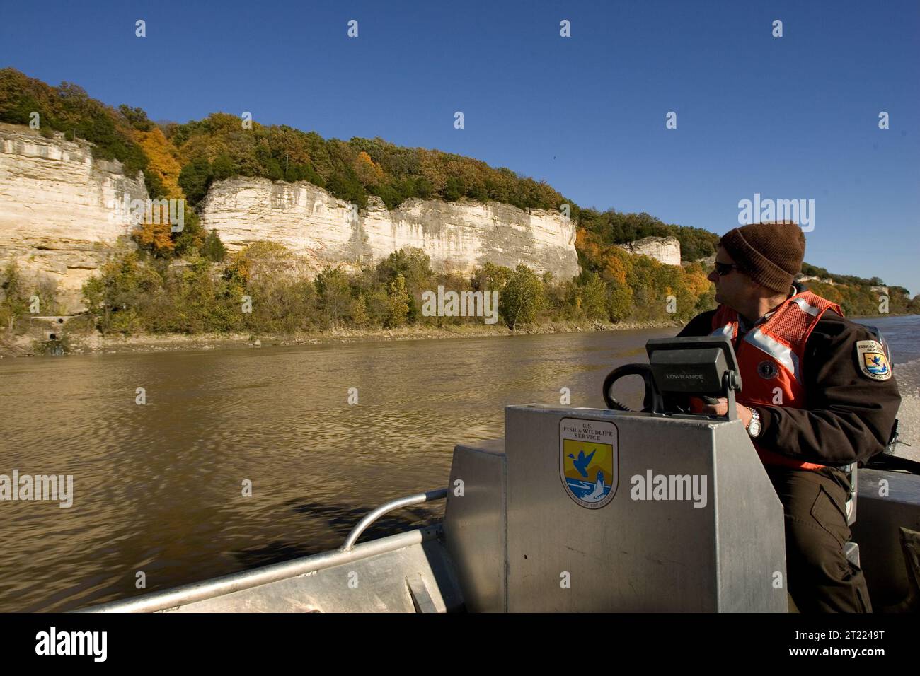 Fish and Wildlife Service employee observes the banks of the Missouri ...