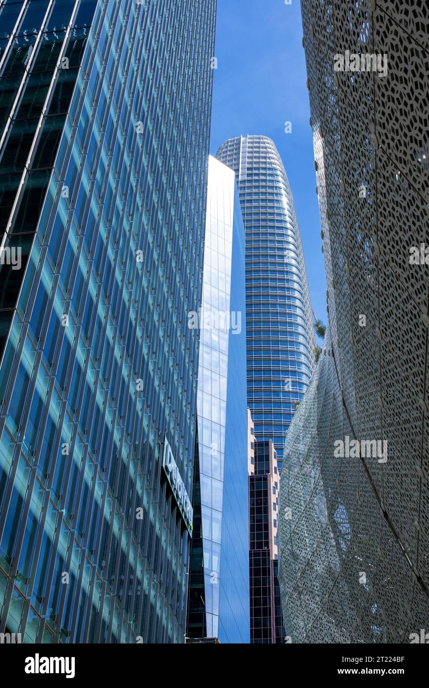 Low angle of multistory office buildings with glass mirrored walls ...