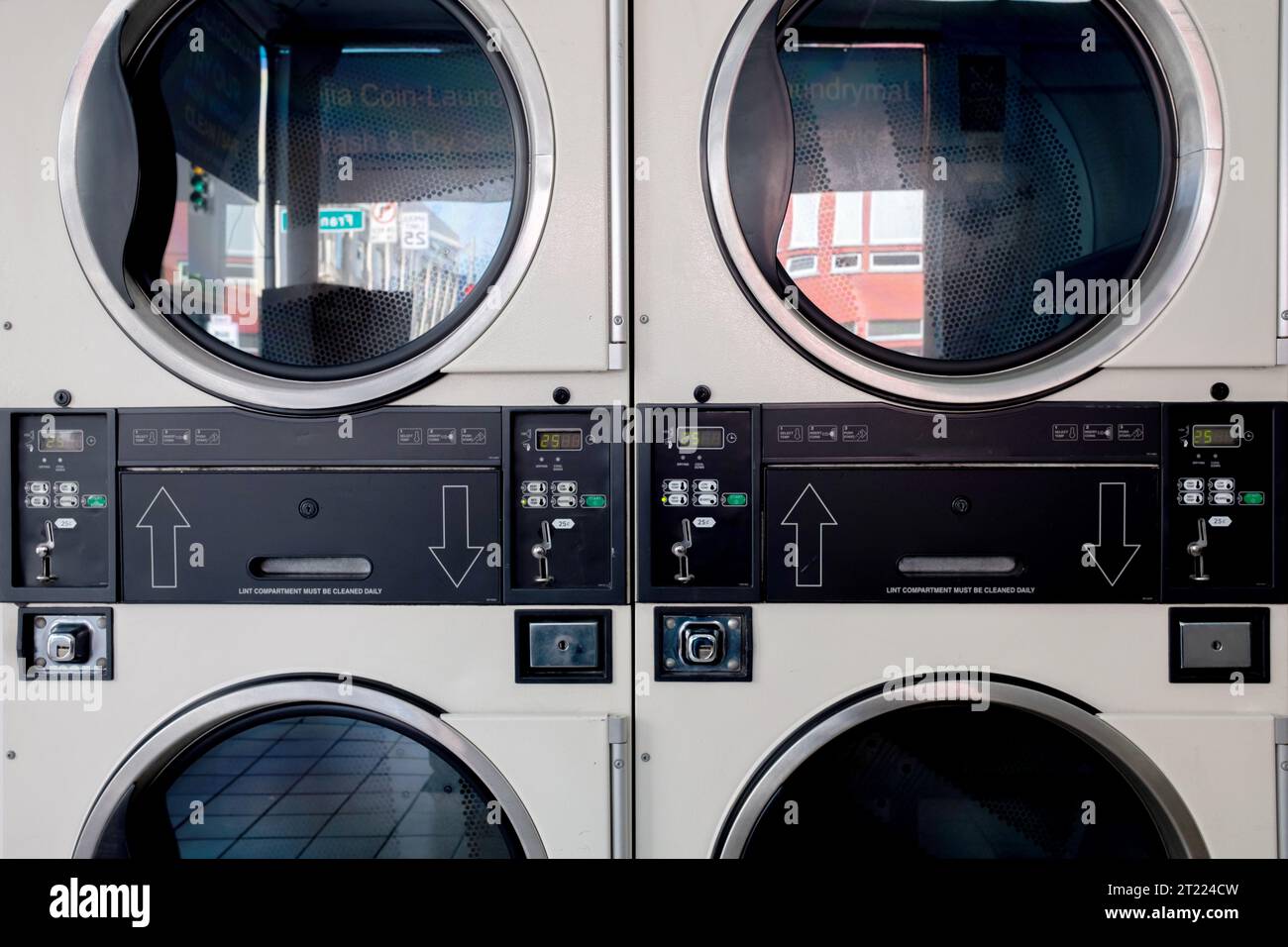 Full frame of coin operated washing machines with closed doors in ...