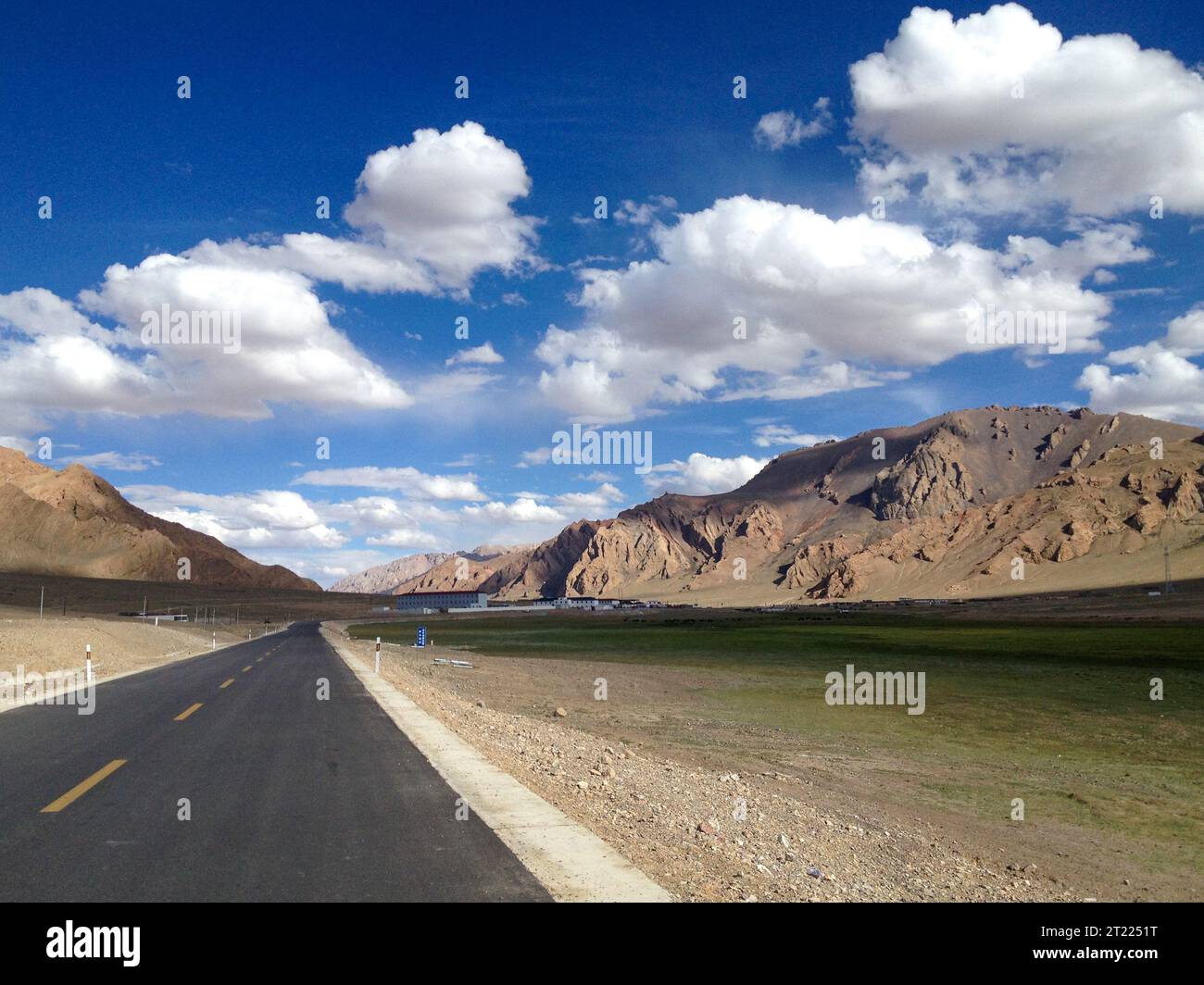 A stunning outdoor image featuring a wide open road stretching out into ...