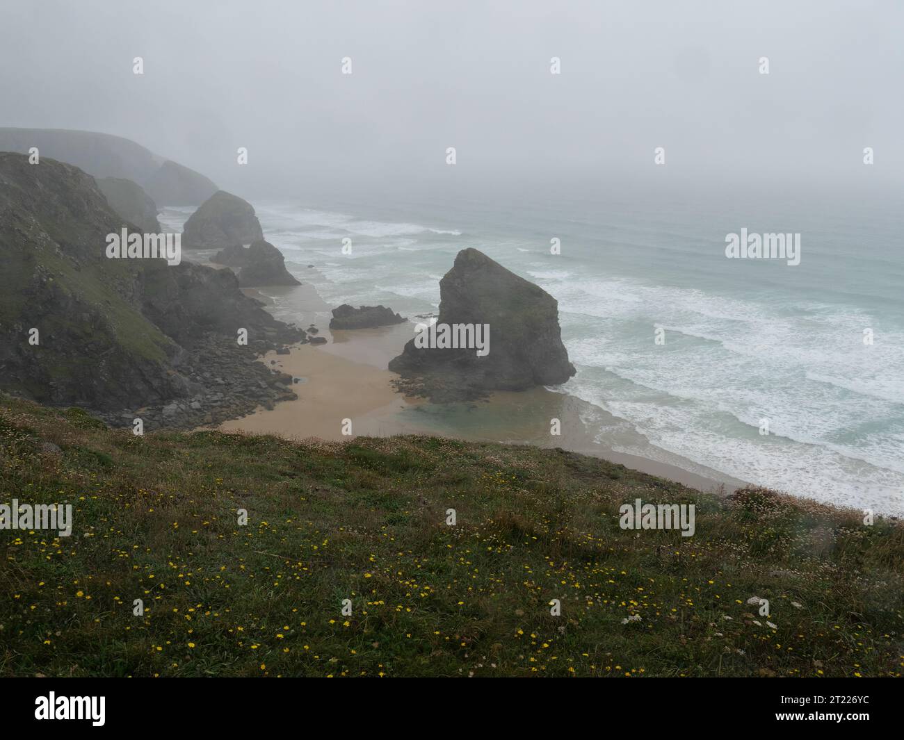 Spectacular rock formations in cloud mist on the cliffs of Bedruthan ...