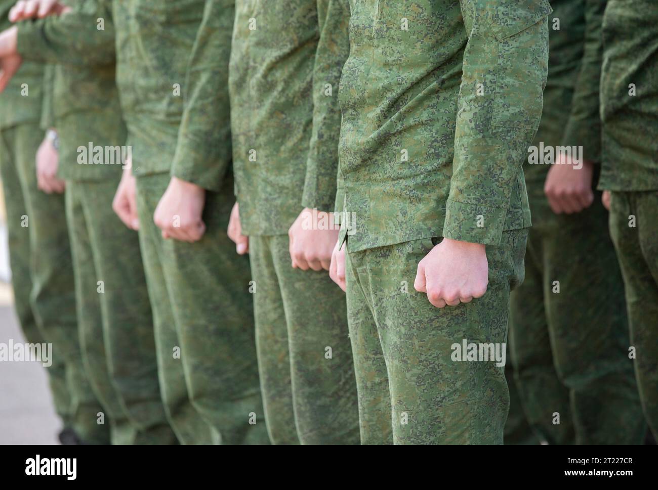 Line of male soldiers in military clothes Stock Photo - Alamy